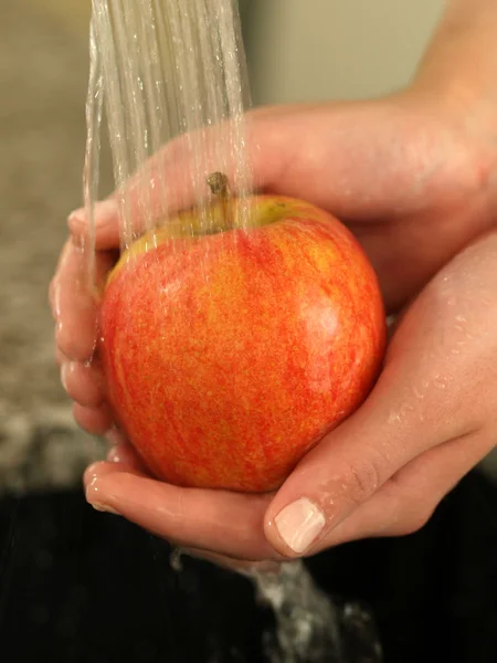 Washing apple - Stock Image - Everypixel