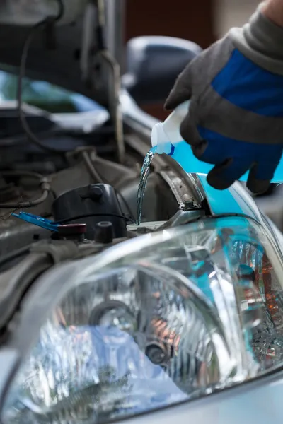 Filling windshield washer fluid - Stock Image - Everypixel