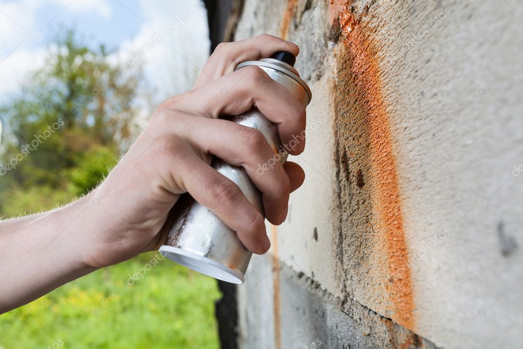Hand holding graffiti spray — Stock Photo © photographee.eu #51202153