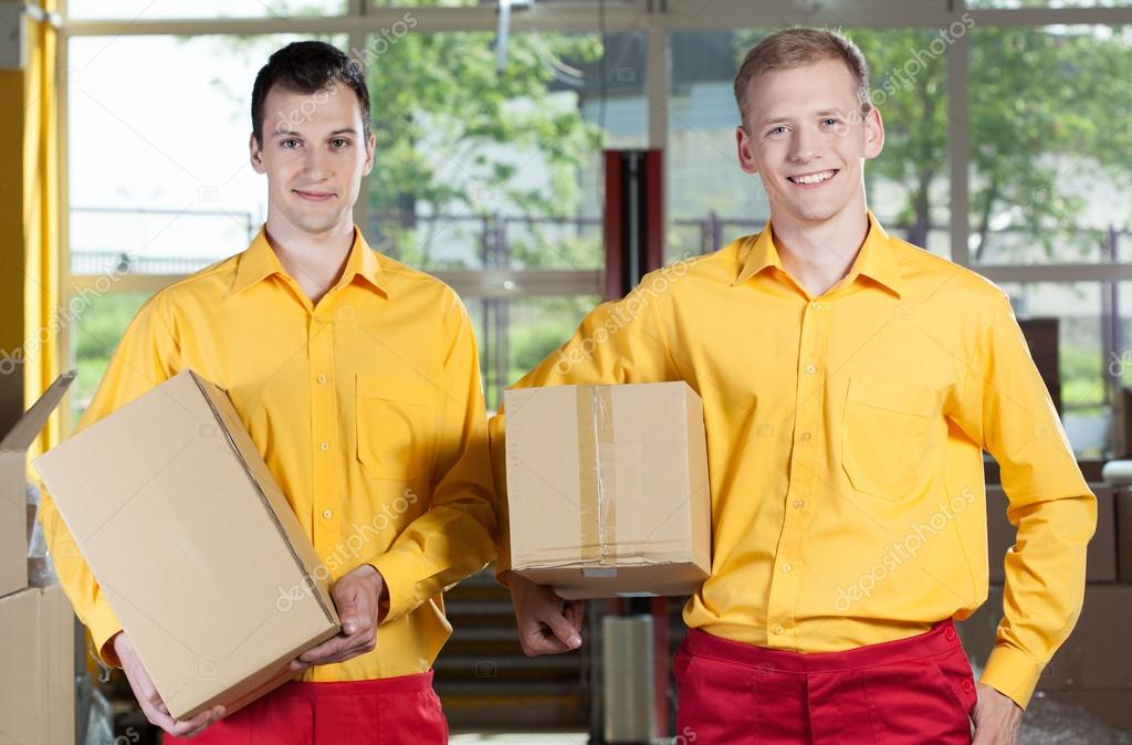 Storekeepers holding boxes in warehouse Stock Photo by ©photographee.eu ...