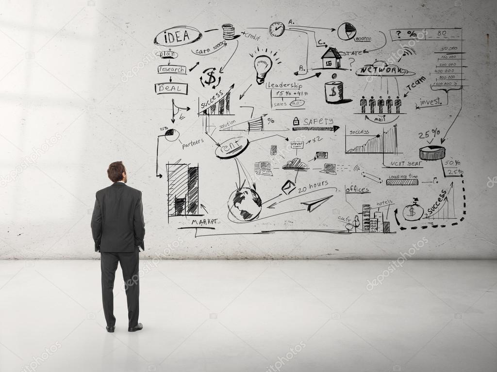 Man looking at business strategy Stock Photo by ©kantver 32582051