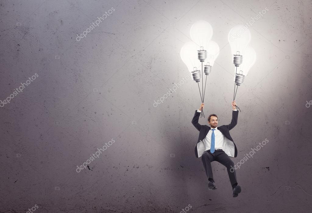 Man flying with light bulbs Stock Photo by ©kantver 42289575