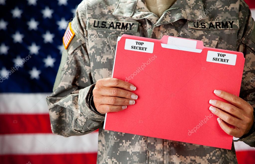 Soldier: Holding Classified Documents Stock Photo by ©sjlocke 24778425