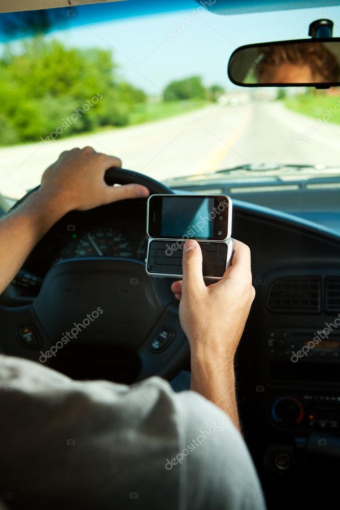 Driving: Texting While Driving — Stock Photo © sjlocke #30977657