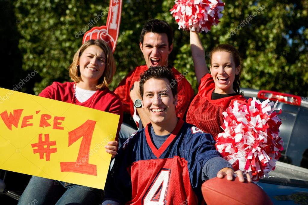 Tailgating: Excited Fans Cheering For Team And Holding Sign Stock Photo ...