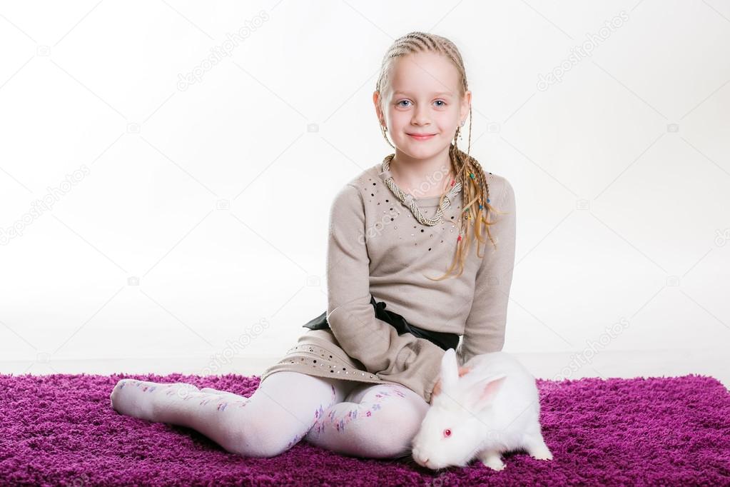 Girl with white rabbit — Stock Photo © HannaNes #30885539