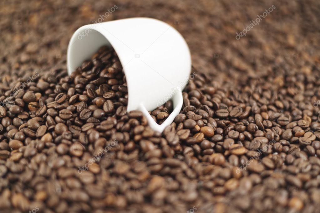 Spilled out of cup coffee beans — Stock Photo © exopixel #25977995