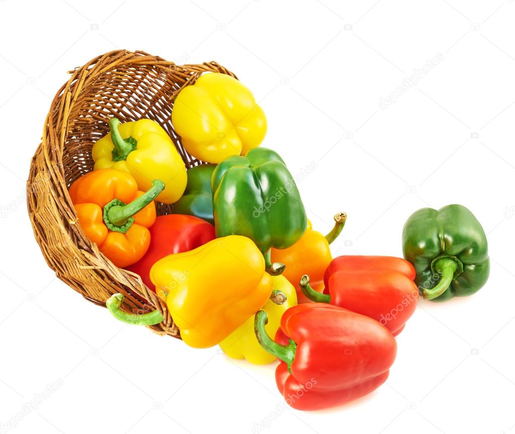 Wicker basket full of bell peppers Stock Photo by ©exopixel 39319365
