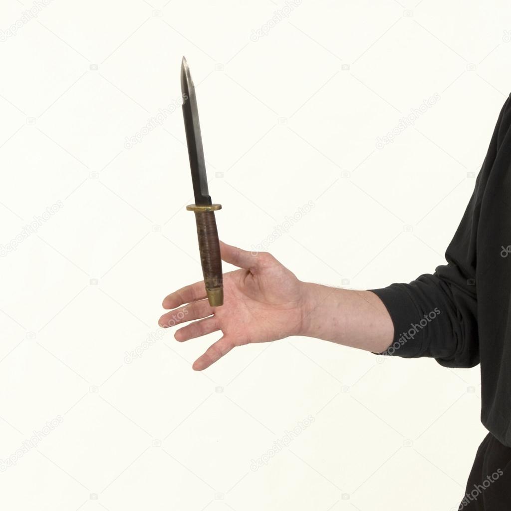 Holding An Old Dagger