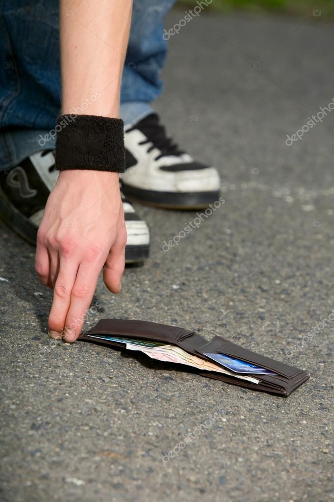Man found someone else's wallet Stock Photo by ©Couperfield 30737885