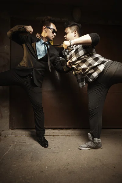 Asian men in street fight — Stock Photo © Couperfield #35113327