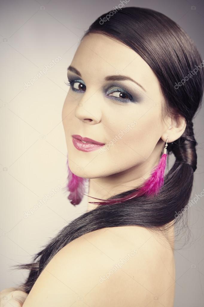 Pretty lady with pink feather earrings Stock Photo by ©Couperfield 38936663