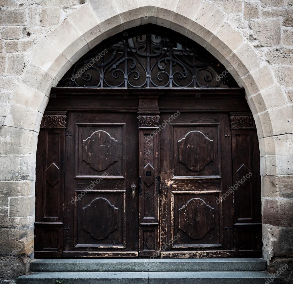 Big dark brown wooden door — Stock Photo © Juhku #34771209