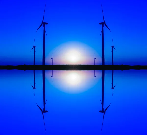 Mirror image silhouette of large wind turbine farm at sunset, Dexter ...
