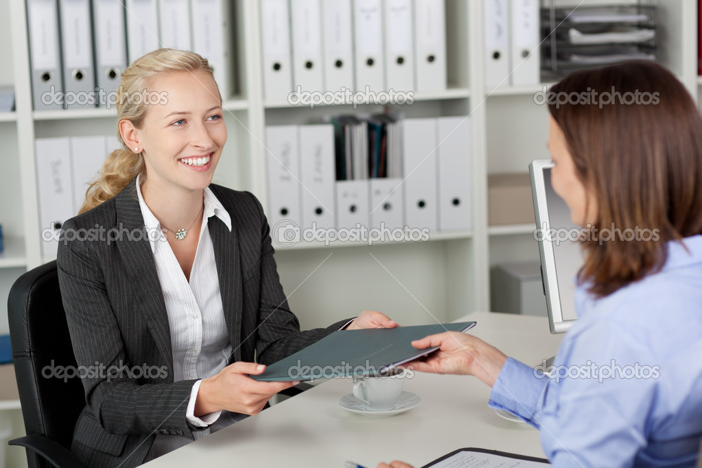 Businesswoman Receiving Application File From Candidate Stock Photo by ...
