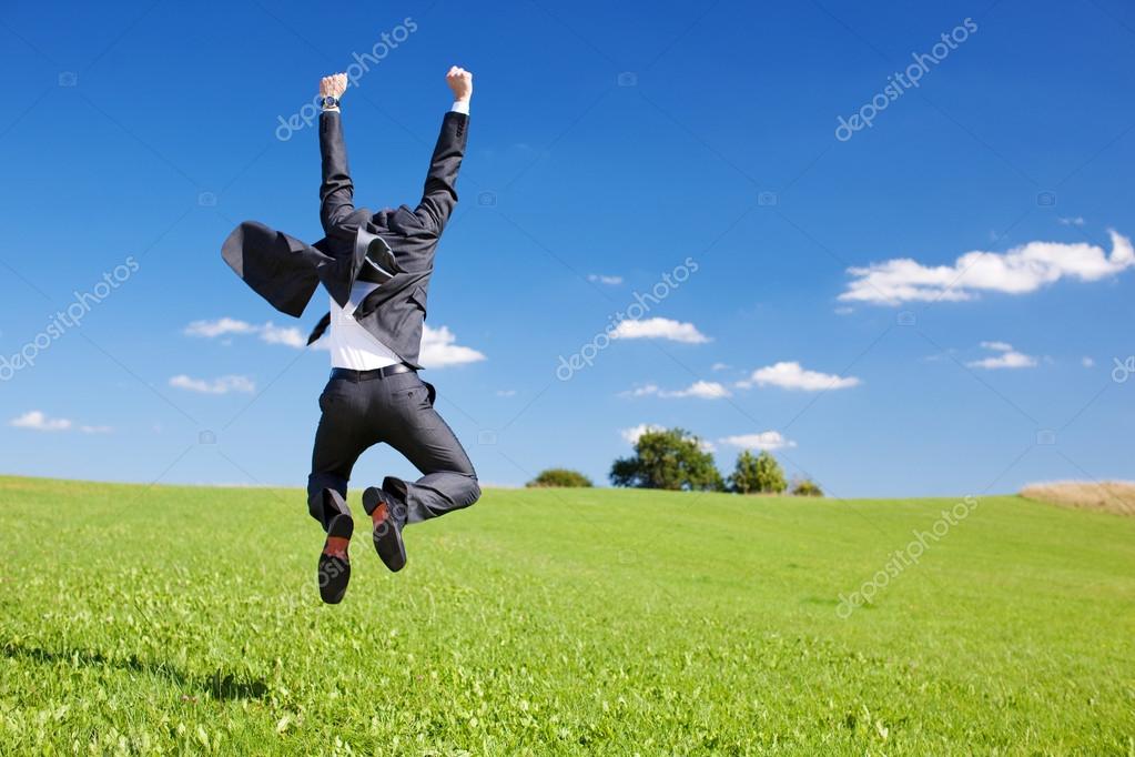 Businessman jumping for joy Stock Photo by ©racorn 26037683