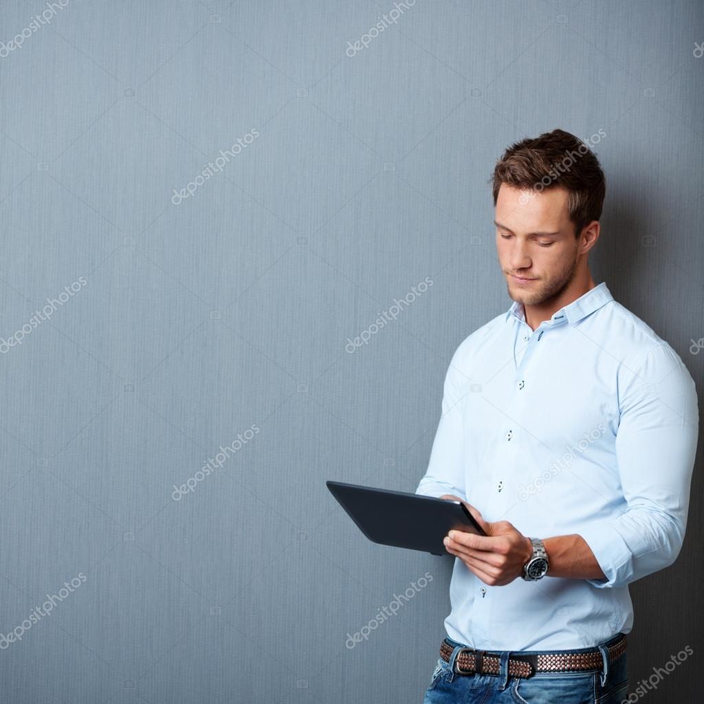 Serious Man Using Digital Tablet Stock Photo by ©racorn 26585267 Serious Man Using Digital Tablet Stock Photo by ©racorn 26585267