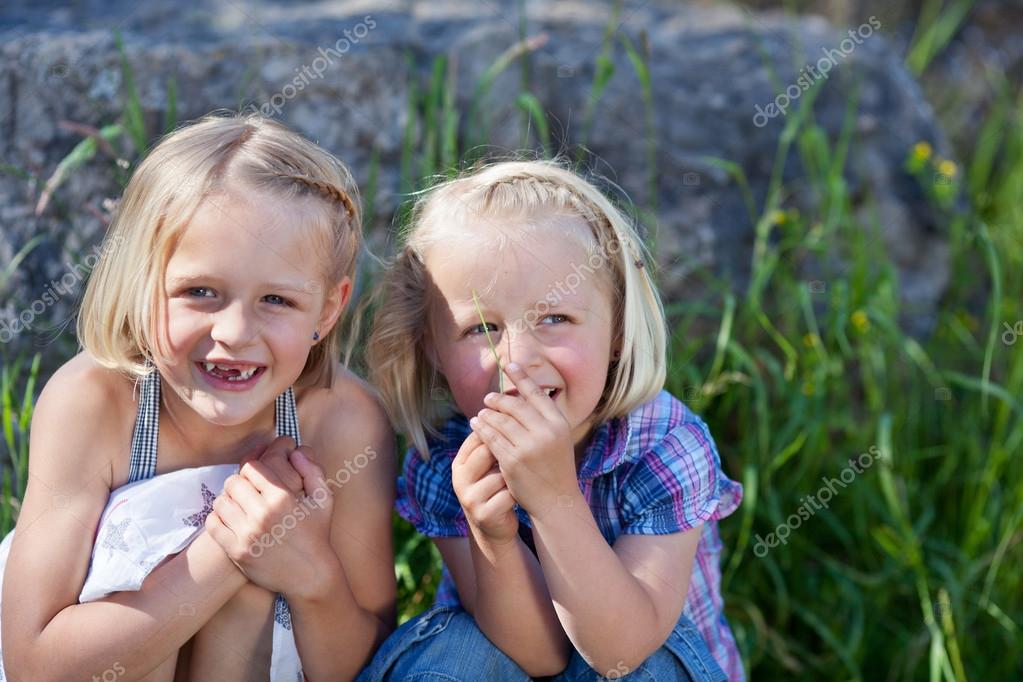 Two mischievous little sisters — Stock Photo © racorn #26613879