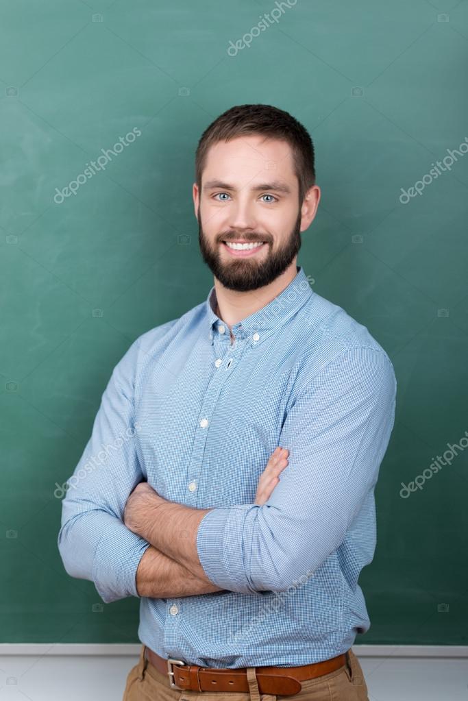 Professor Standing Against Chalkboard Stock Photo by ©racorn 26742111