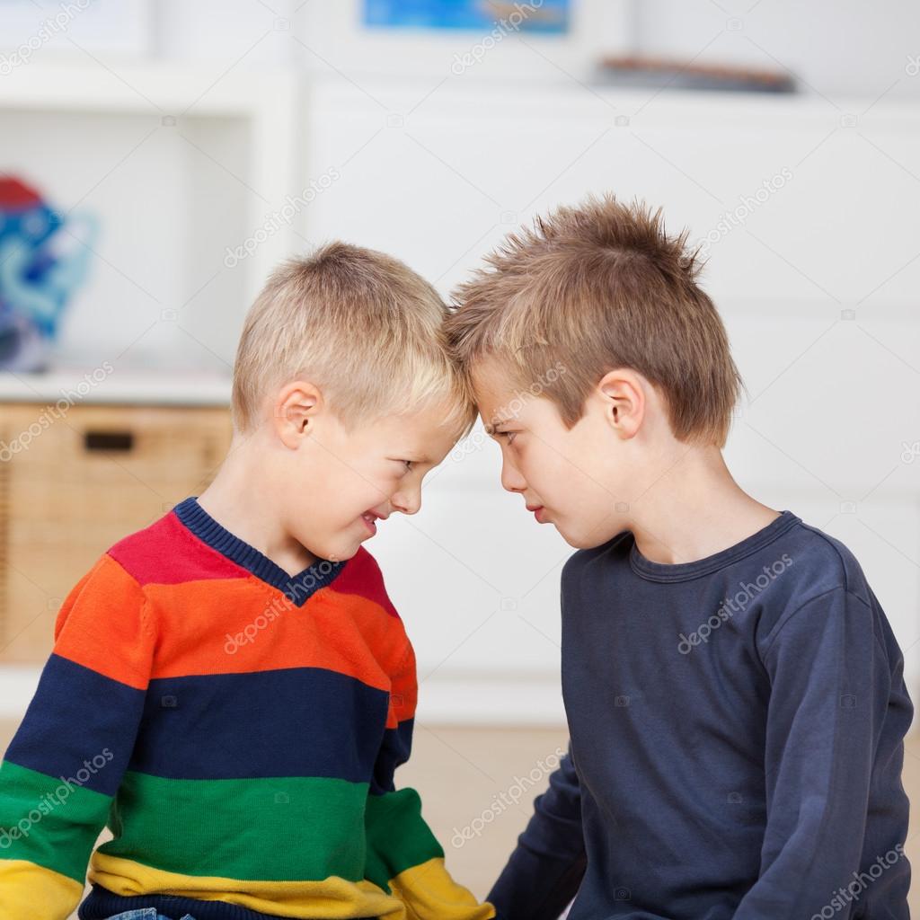 Angry Brothers With Head To Head In House — Stock Photo © racorn #27076811