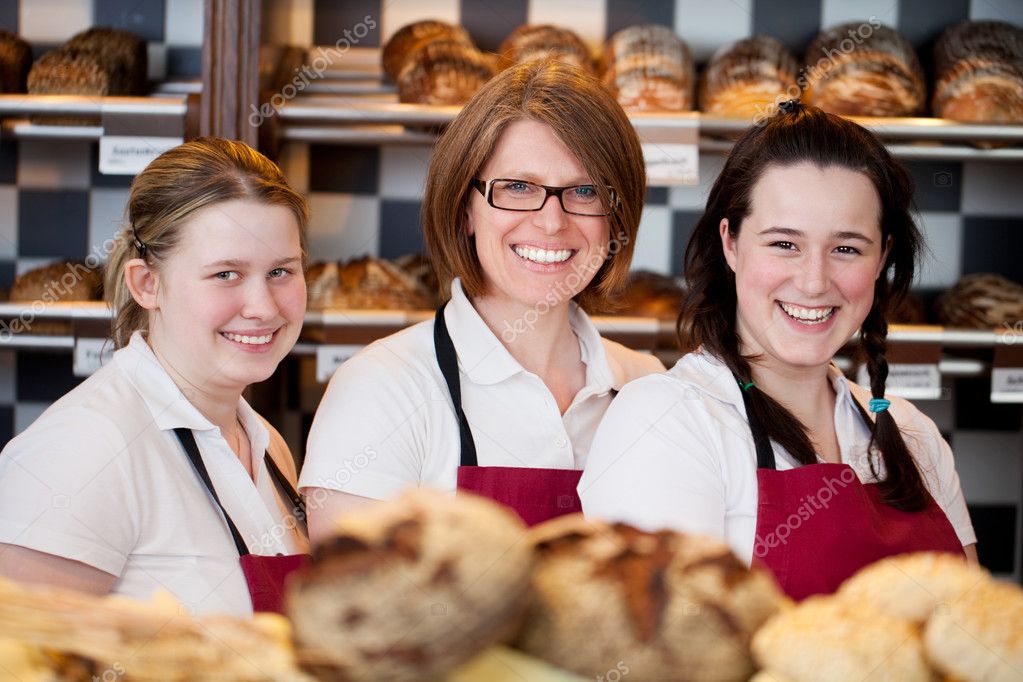 Three happy bakery workers — Stock Photo © racorn #27103573