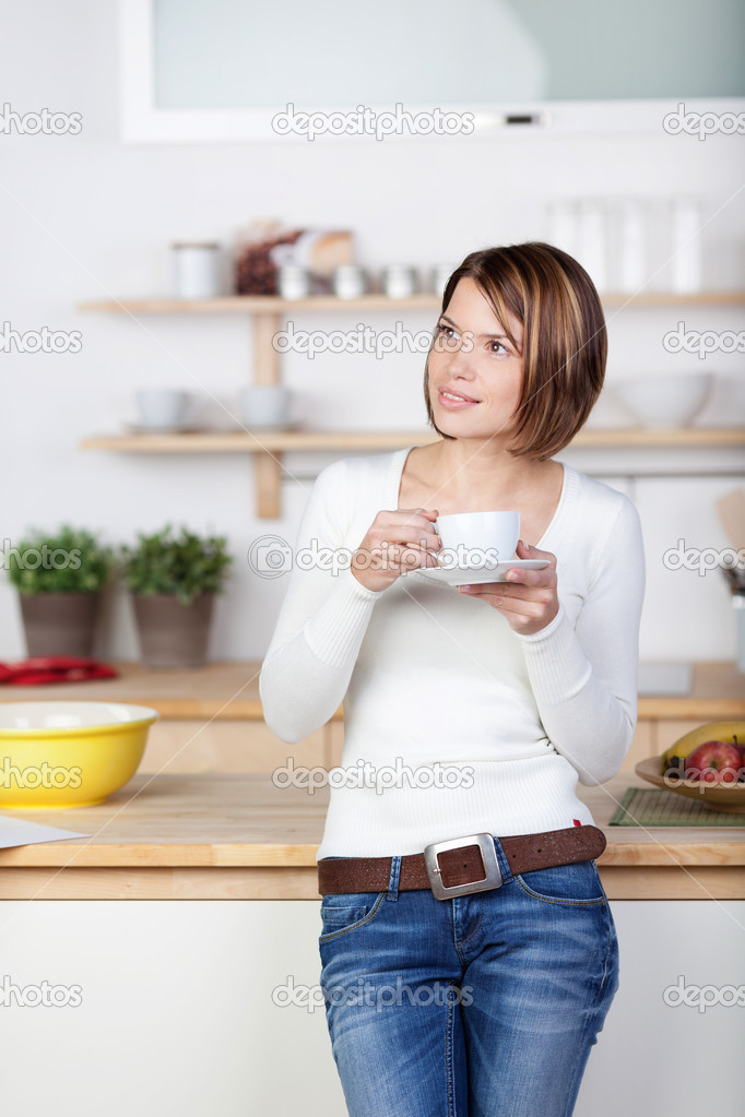 Woman standing relaxed and drinking coffee — Stock Photo © racorn #27134877