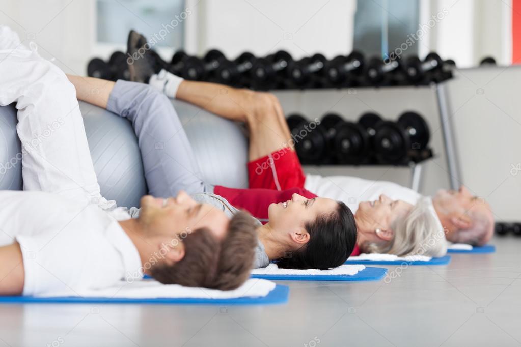 Group of diverse age training at the gym Stock Photo by ©racorn 29507665