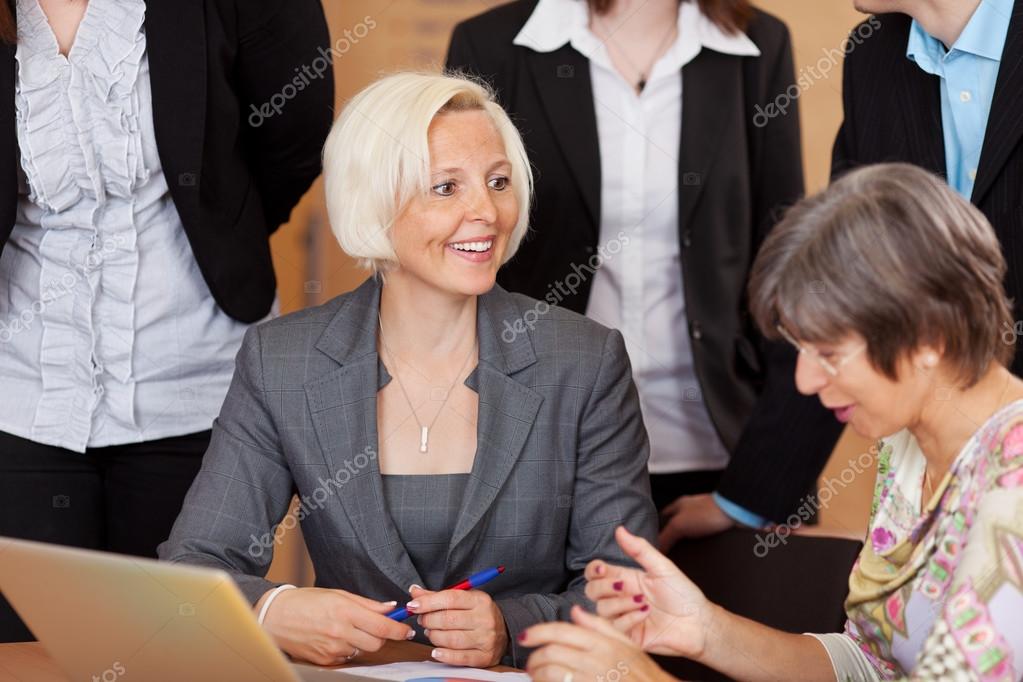 Two business women discussing a project Stock Photo by ©racorn 29706859