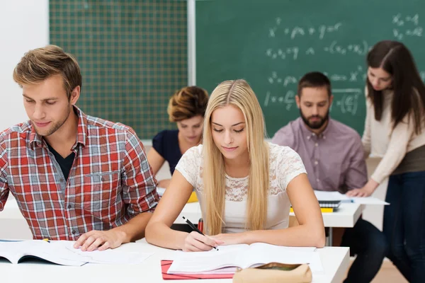 University students studying together Stock Photo by ©racorn 31317779