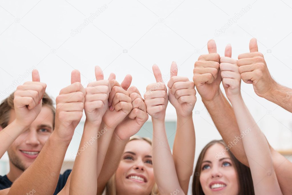 Diverse business people giving a thumbs up — Stock Photo © racorn #31822695