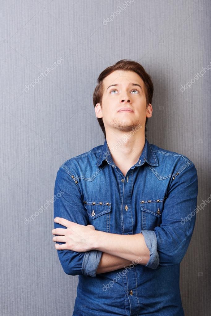 Young man standing thinking Stock Photo by ©racorn 35904849