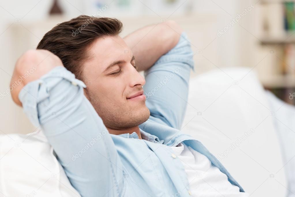 Contented man relaxing at home — Stock Photo © racorn #45029917