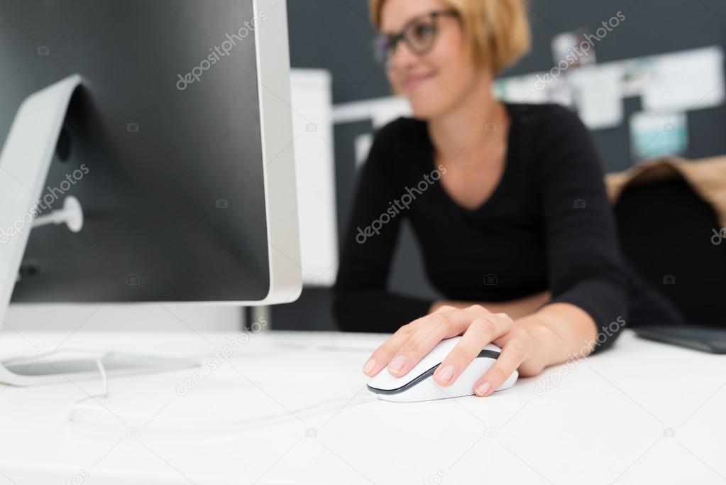 Businesswoman using computer mouse Stock Photo by ©racorn 51573483