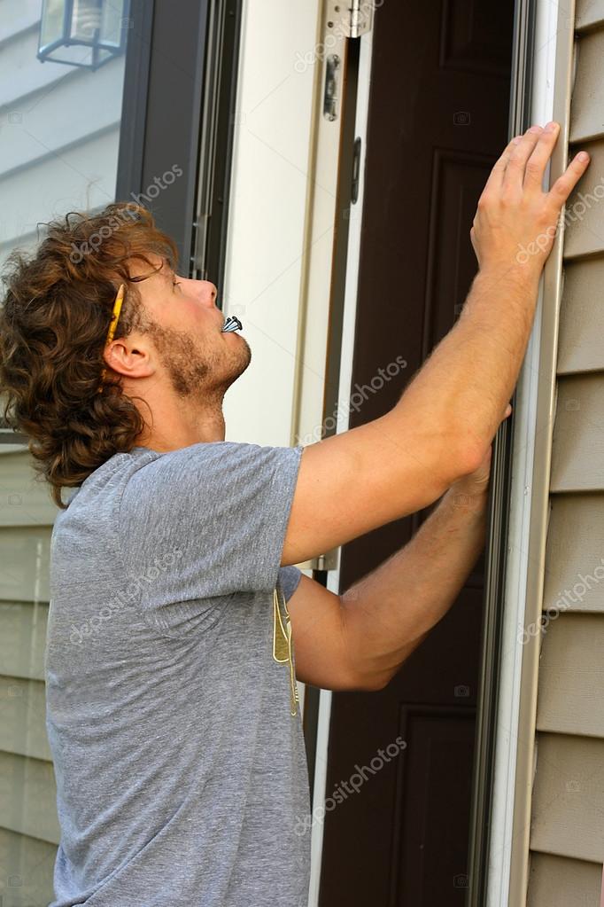 Carpenter Fixing Door Stock Photo by ©Christin_Lola 31653315