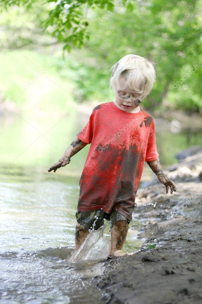 Little Boys Playing In Mud