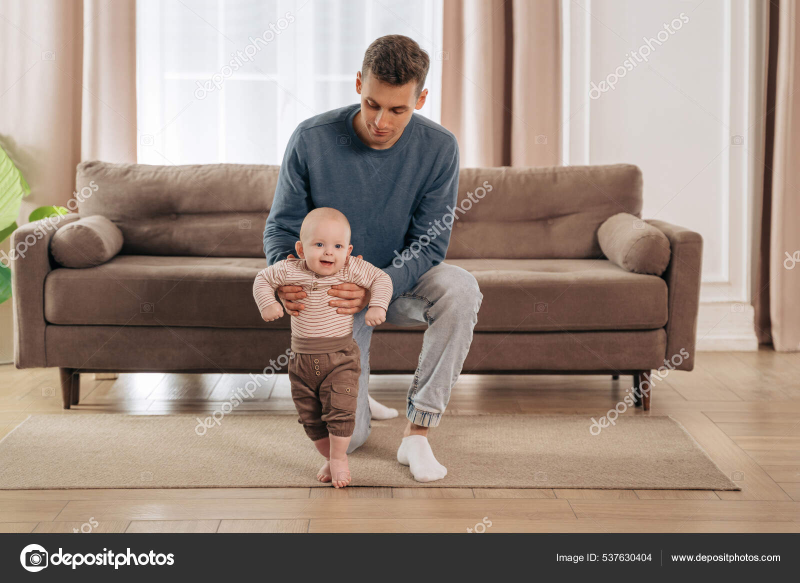 Baby Boy Taking His First Steps Father's Help Home Happy Stock Photo by ...