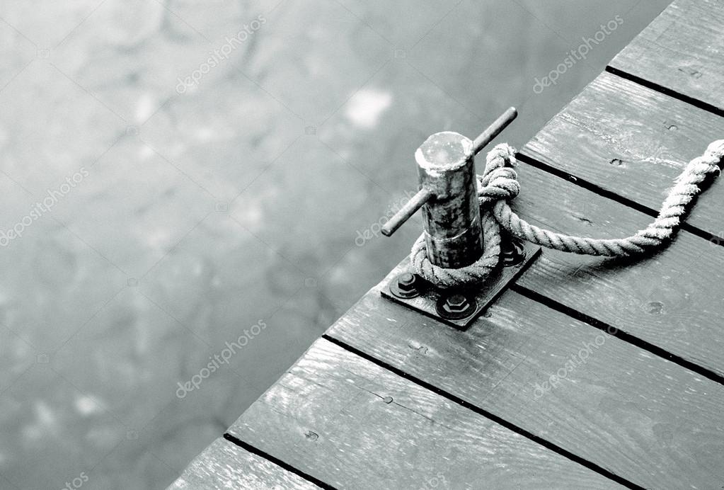 Taut ropes to a bollard on a pier Stock Photo by ©Stockdonkey 30046833