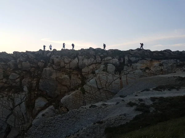 Many people in dark climbing mountain Stock Photos, Royalty Free Many ...