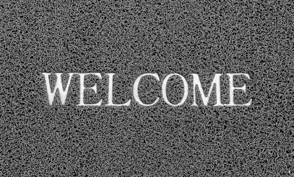 Welcome title on the gray plastic doormat for texture background ...