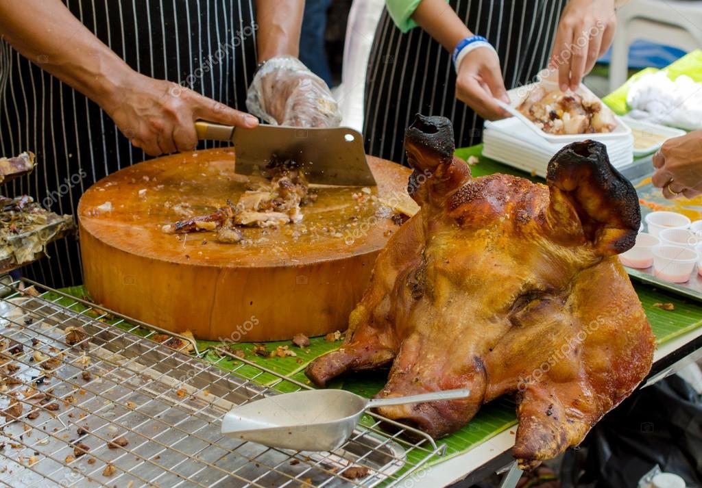 Grilled whole roasted pig Spit roasting is a traditional — Stock Photo ...