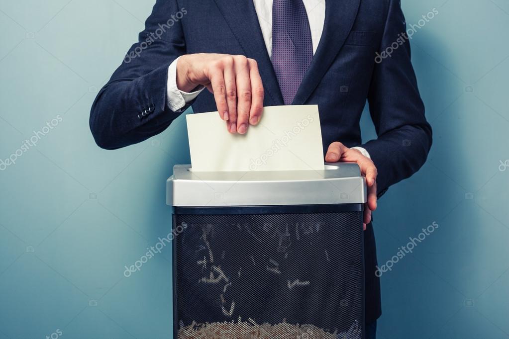 Businessman shredding documents — Stock Photo © lofilolo #41036299