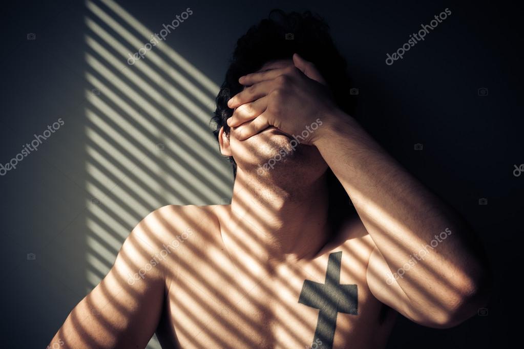 Sad man sitting by window Stock Photo by ©lofilolo 43828605