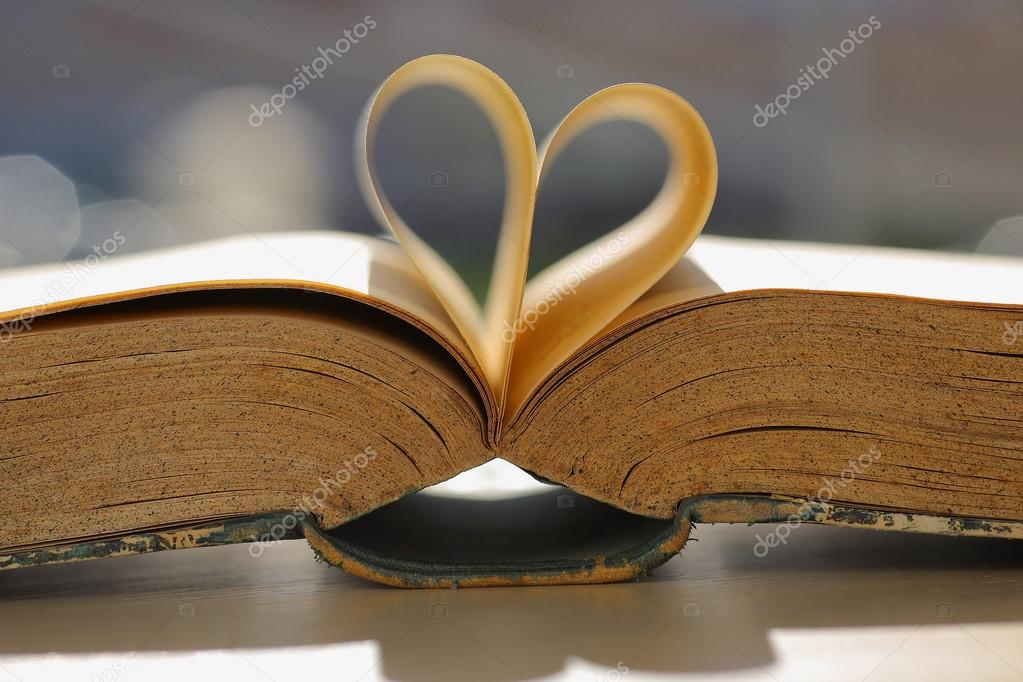 Book with heart shape. — Stock Photo © bogomyako #26440169