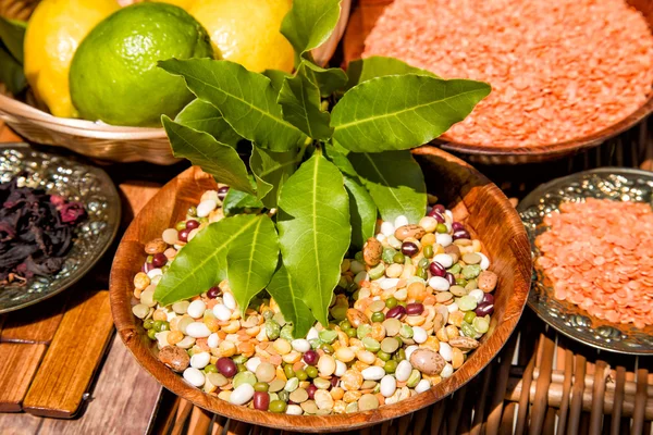 Shiva Linga made up of black stone decorated with flowers & bael leaf ...