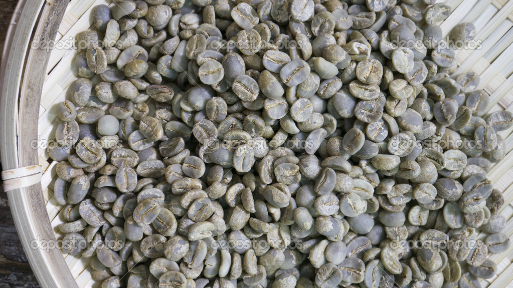 Raw coffee beans Stock Photo by ©udeyismail 31447565