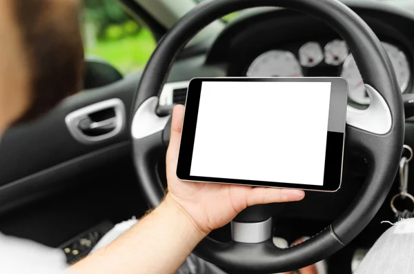 Car driver with the Tablet PC - Stock Image - Everypixel