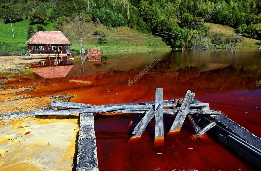 Water pollution of a copper mine exploitation Stock Photo by ...