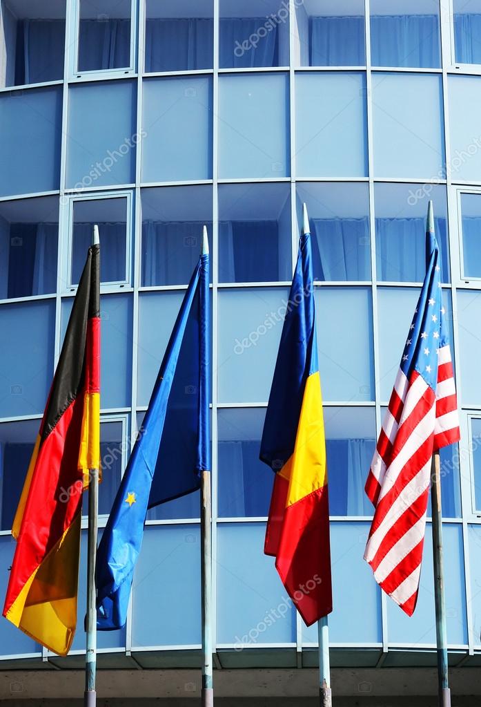 Corporate building with different world flags — Stock Photo ...