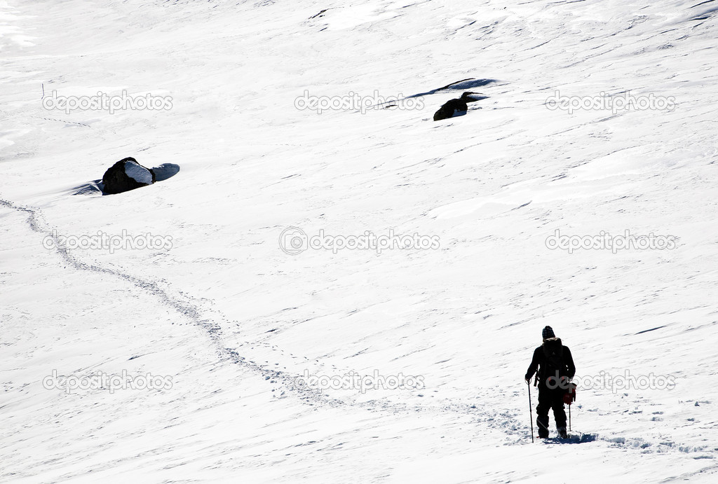 Alpinist traversing a glacier Stock Photo by ©rechitansorin 26100077