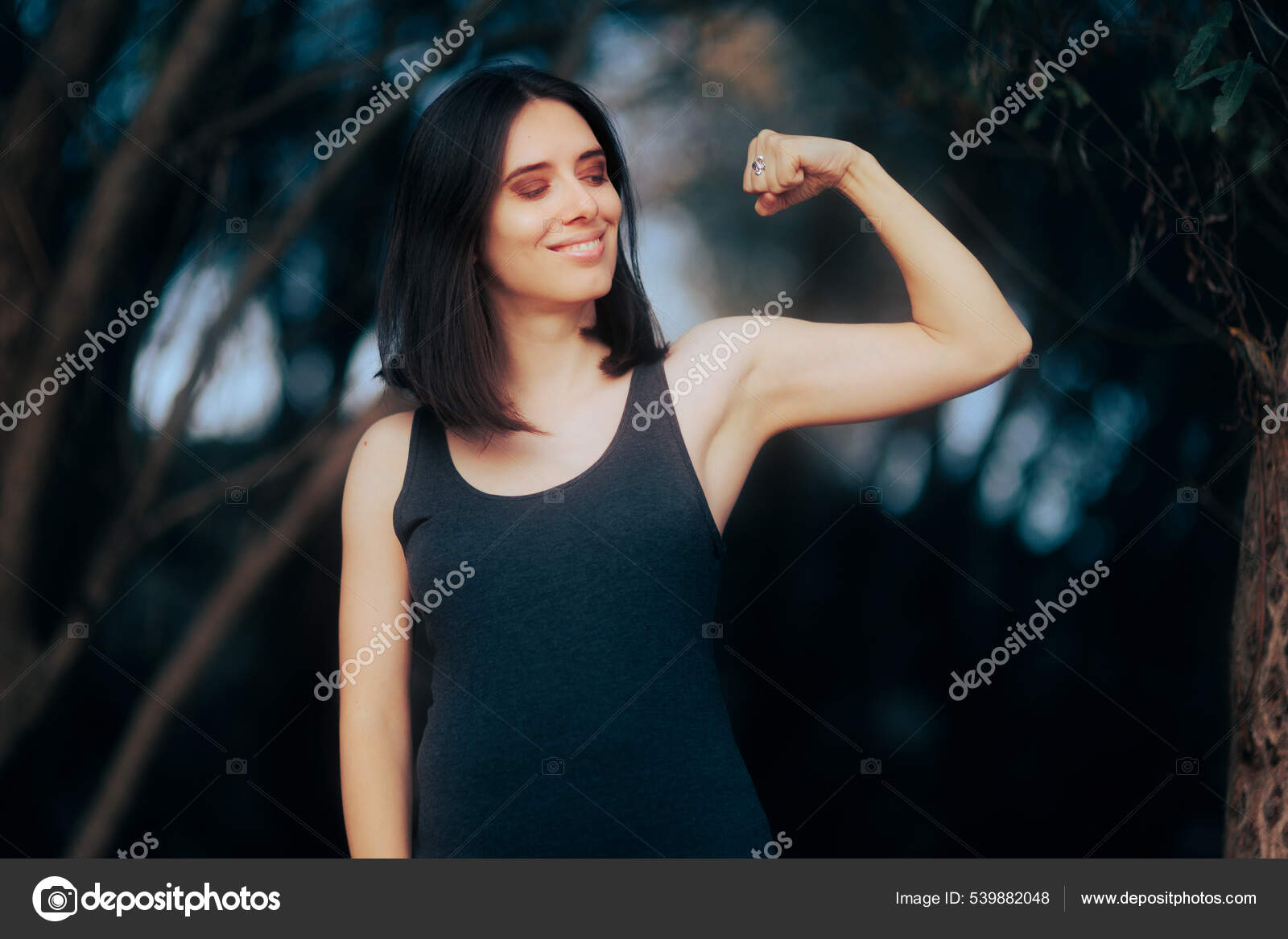 Strong Woman Flexing Her Arm Feeling Fit Empowered Stock Photo by ...